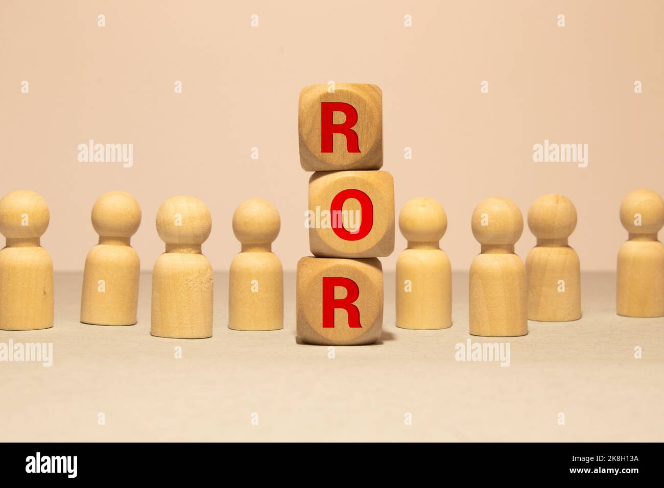 Wooden blocks with the word ROR. Rate of return. The level of ...