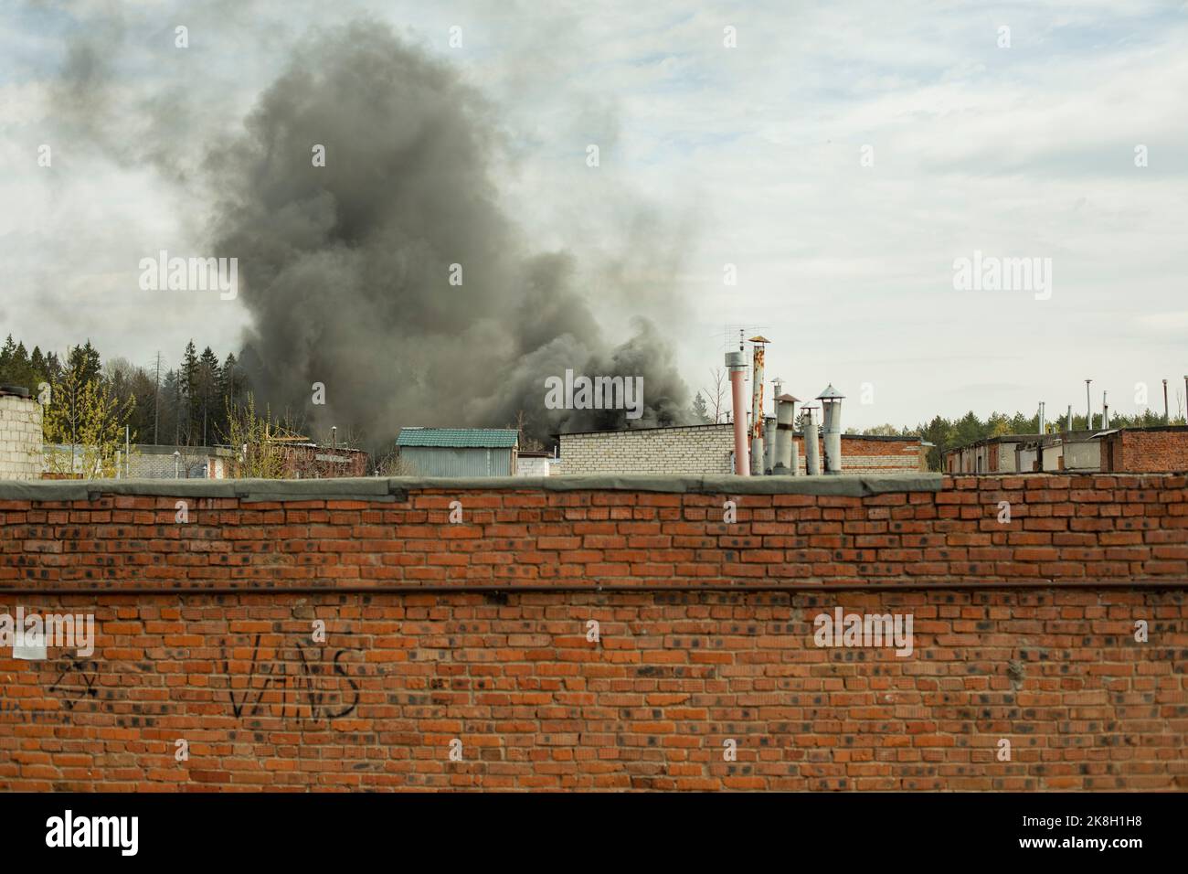 Burning of building. Smoke over buildings. Smoke in sky. Extreme ...