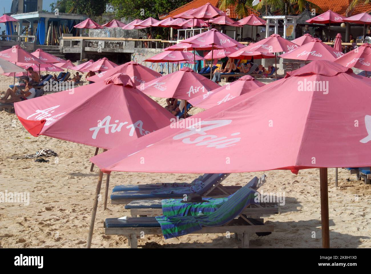 Pink Sun Umbrellas, Dreamland Beach, Bali, Indonesia Stock Photo - Alamy