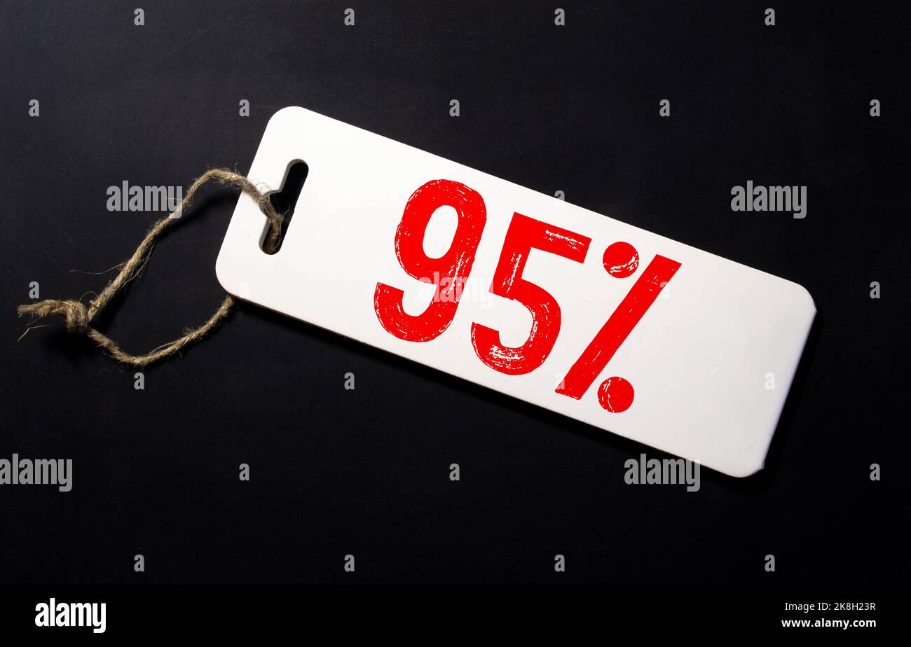 ninety five percent mark made from red clothes on a white background ...