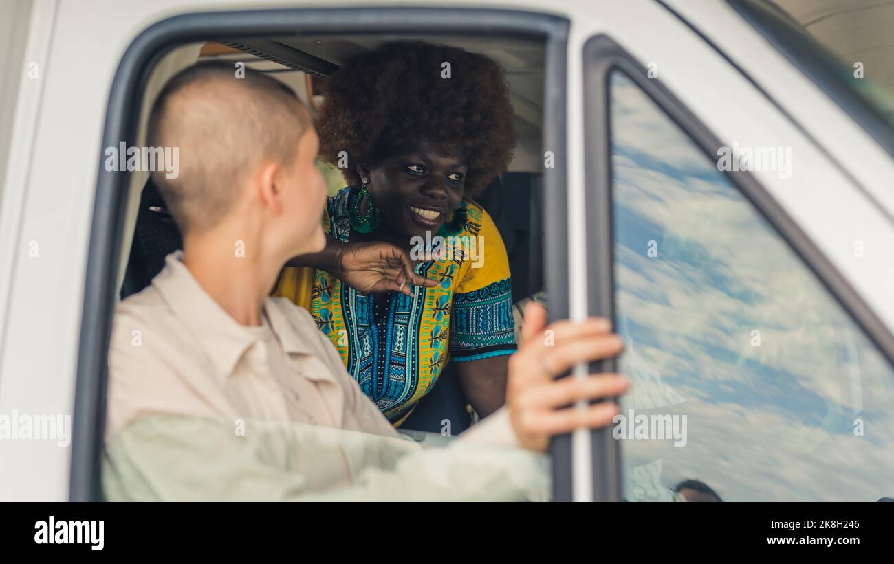 Friends traveling in a van together. Motorhome concept. Caucasian bald ...