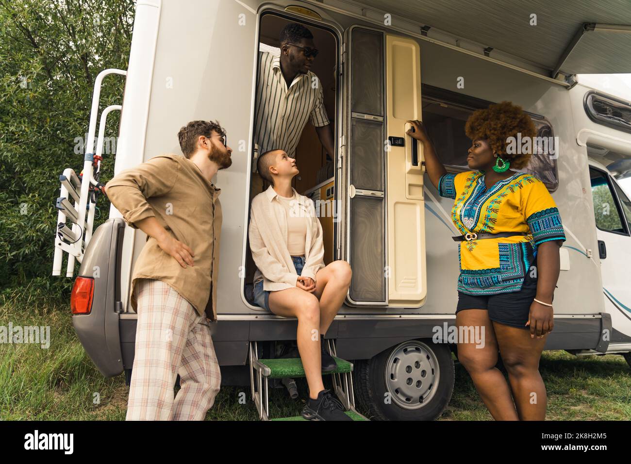 Laid-back group of multi-cultural and multi-ethnic friends standing in ...