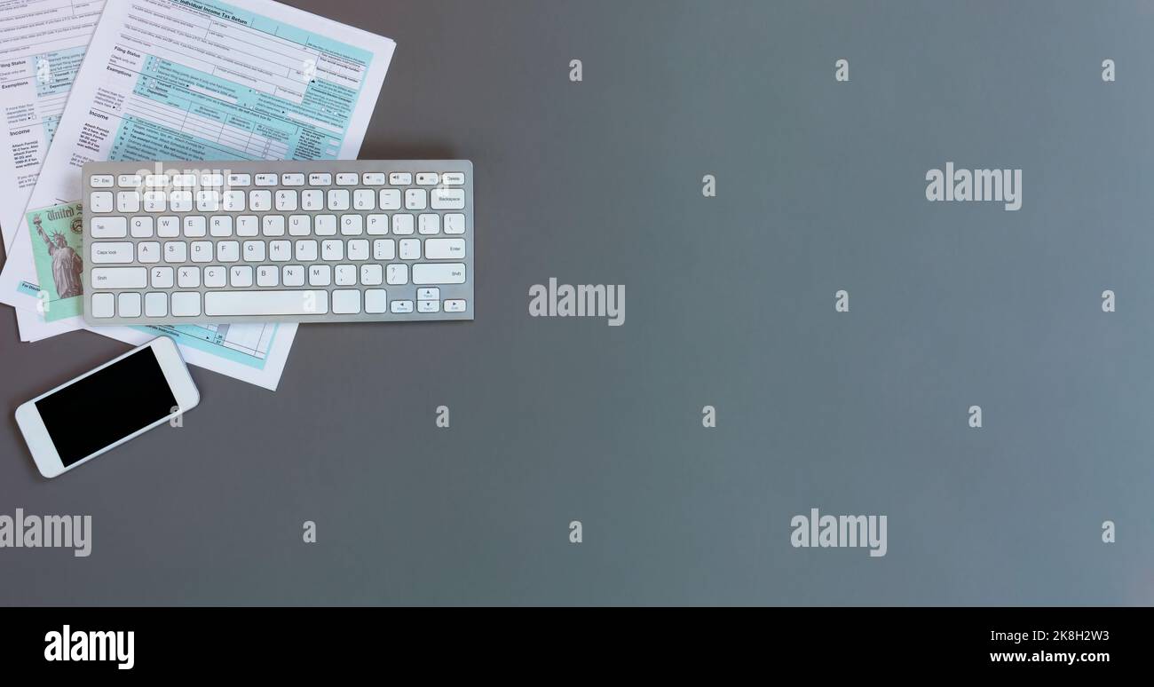 US Individual income tax return with modern technology office items and ...