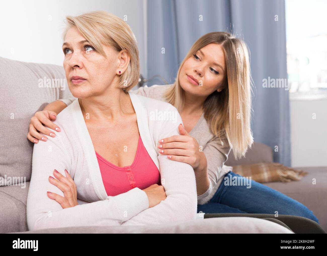 daughter comforts a sad mother Stock Photo - Alamy