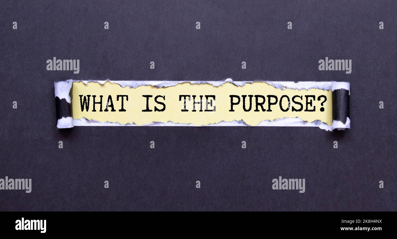 Notepad with text WHAT IS THE PURPOSE on a white background, near ...