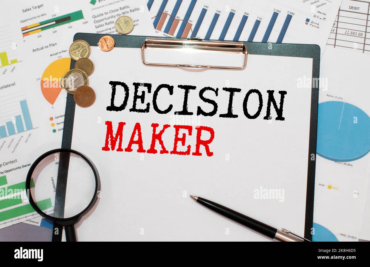 Closeup on businessman holding a card with DECISION MAKER message ...