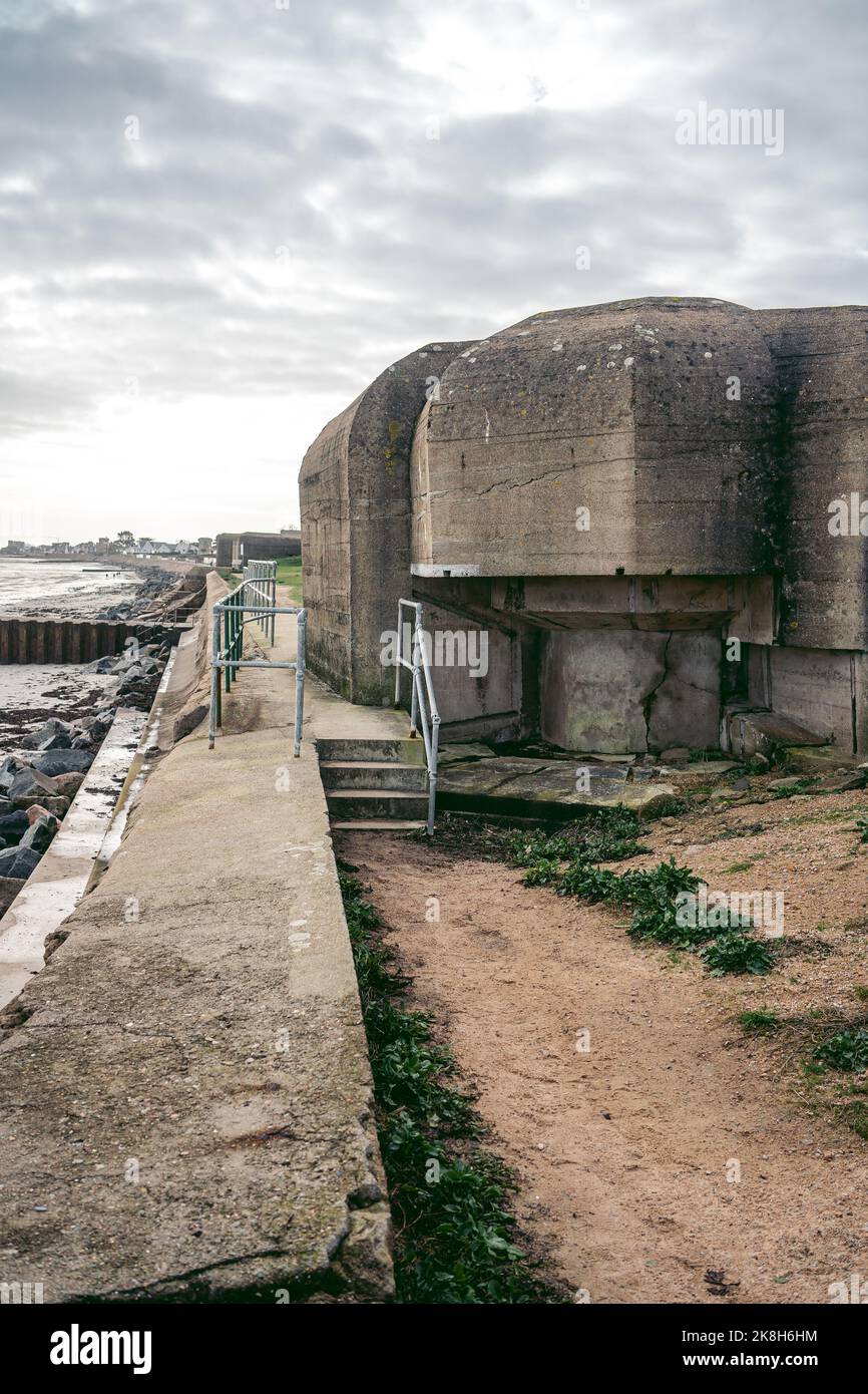 Abandoned World War II bunker on the cliffs of the island on cloudy day ...