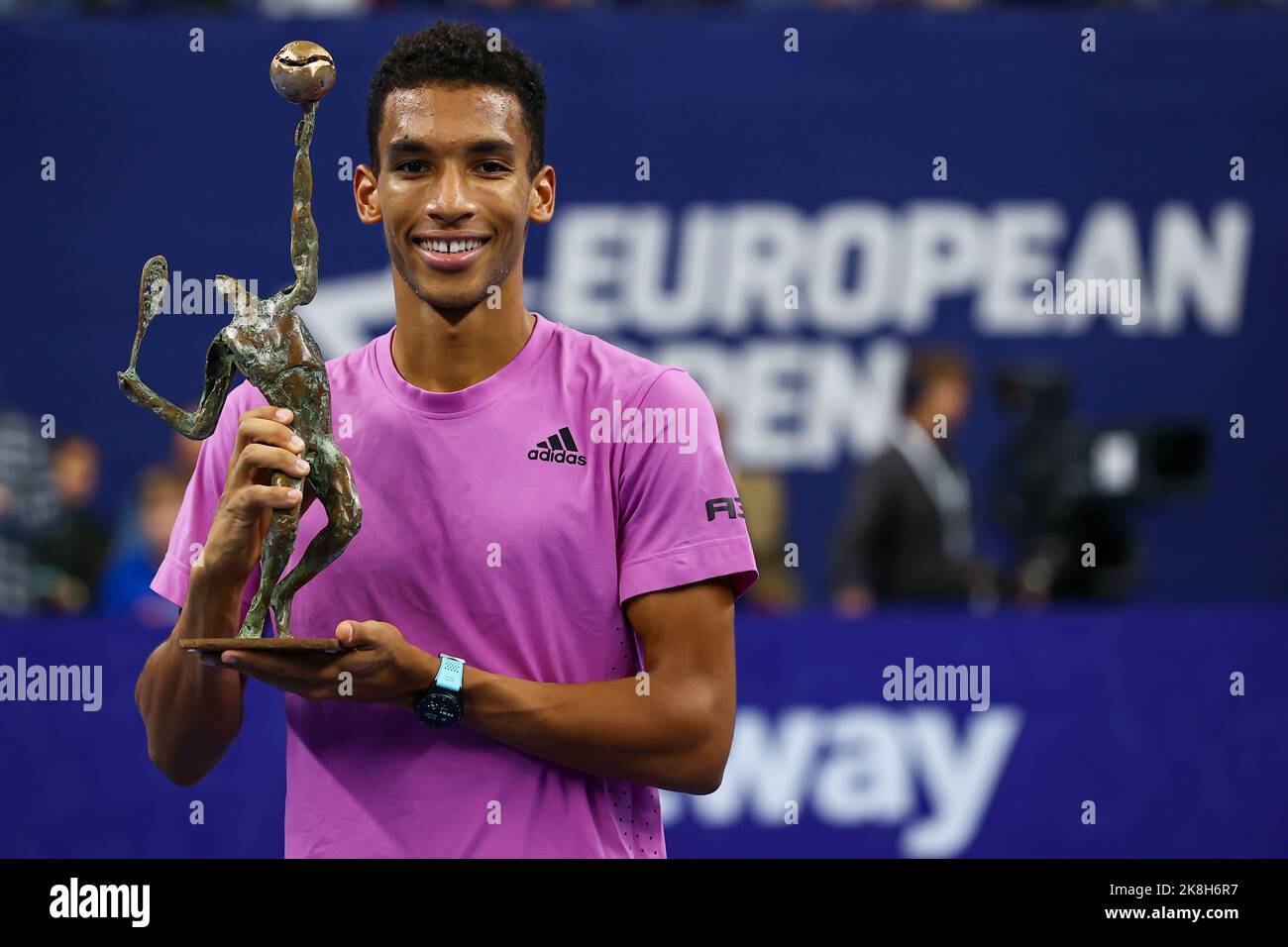 Canadian Felix Auger-Aliassime poses for the photographer with the winners trophy after the men ...