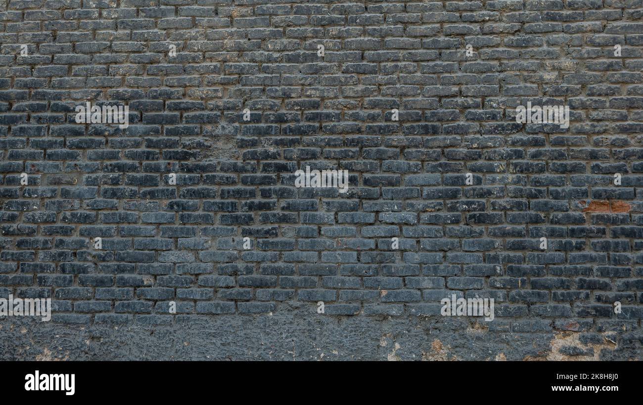 Horizontal part of dark brick wall background. Exterior wide old stone ...