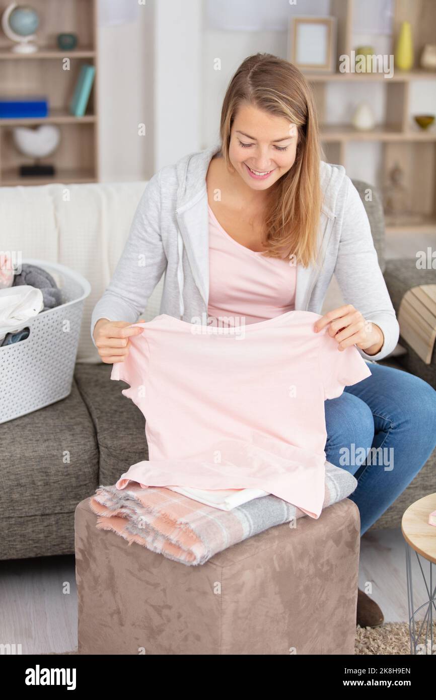 beautiful young woman doing laundry Stock Photo - Alamy