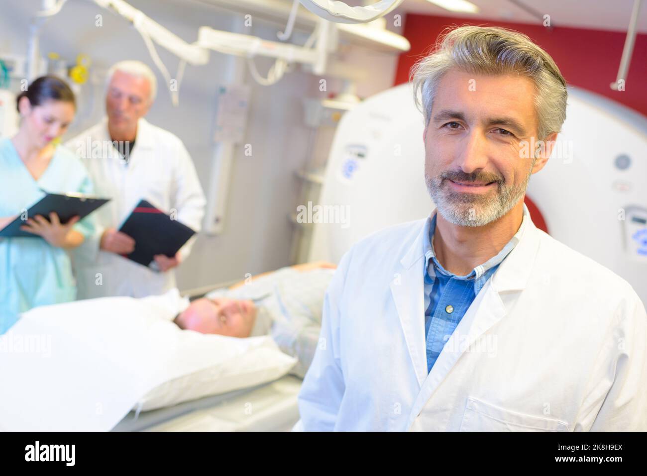 mri machine and screens with doctor and nurse Stock Photo - Alamy