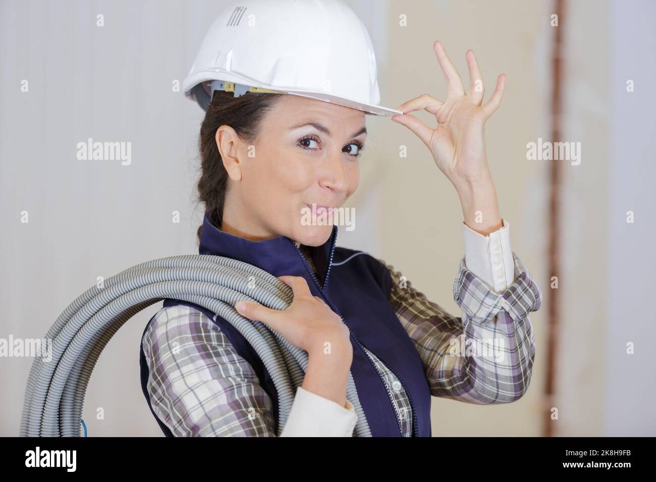 a cheeky female architect having fun at work Stock Photo - Alamy