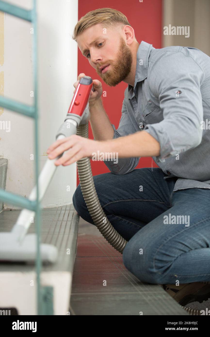 Man hoovering home hi-res stock photography and images - Alamy