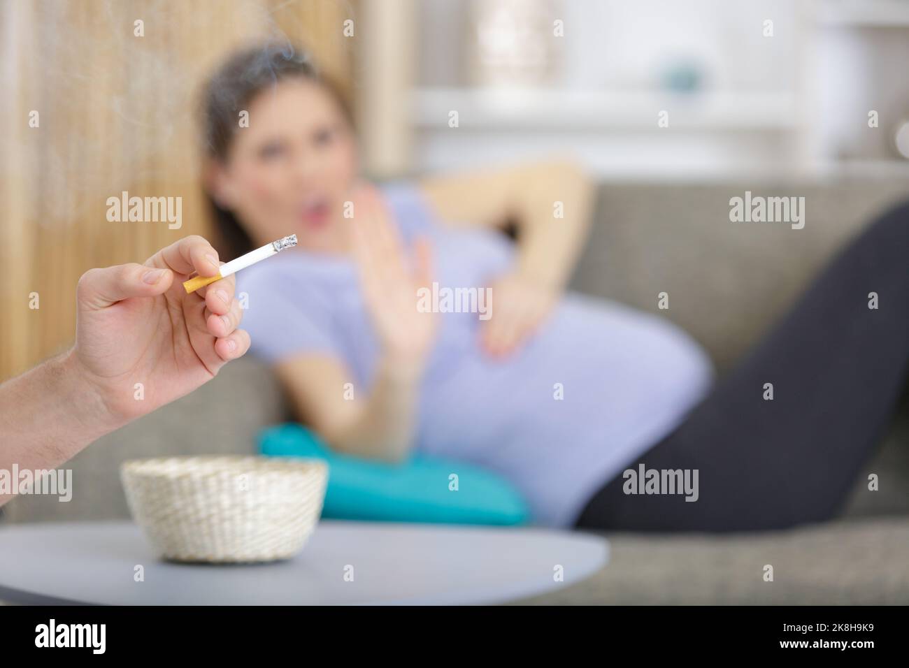 she is asking to stop smoking cigarettes Stock Photo - Alamy