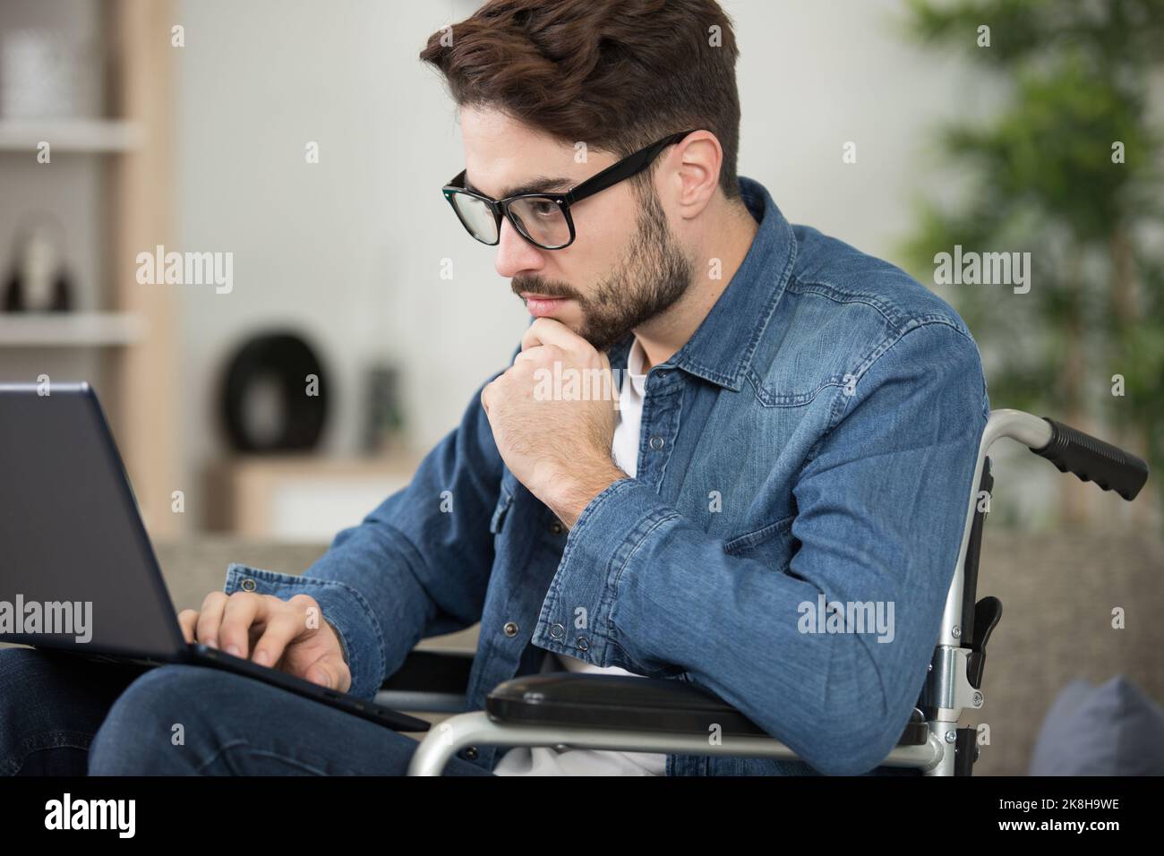 Disabled man using computer typing hi-res stock photography and images ...