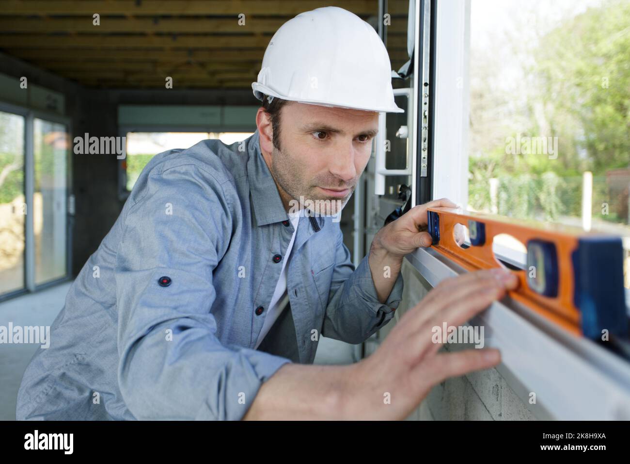 construction worker with level tool Stock Photo - Alamy