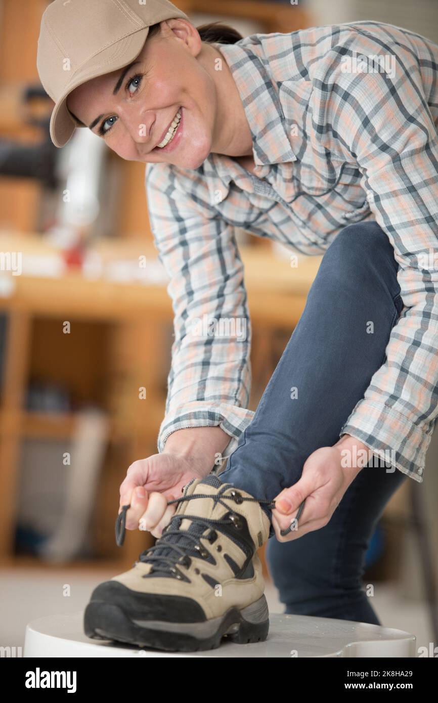 Doing up laces hi-res stock photography and images - Alamy
