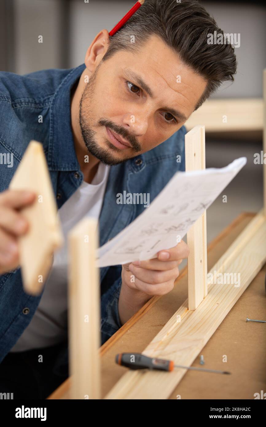 male handyman carpenter at interior wood door lock installation Stock ...