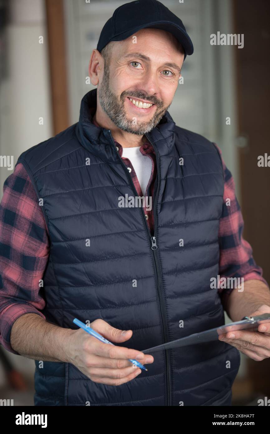 smiling service man worker smiling at camera Stock Photo - Alamy