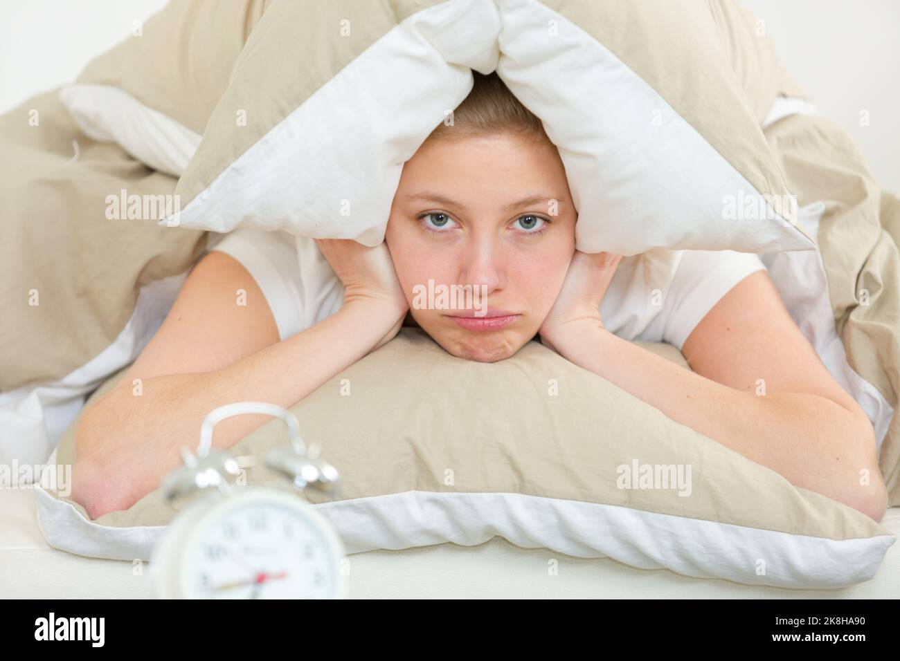 portrait of a sleepy young brunette woman Stock Photo - Alamy