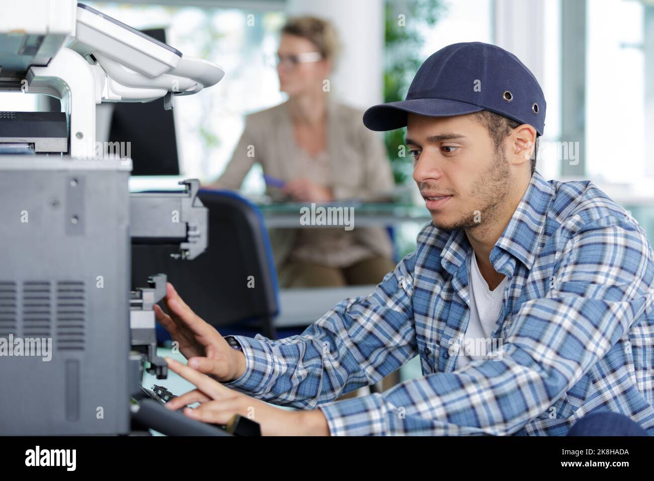 a technician fixing a printer Stock Photo - Alamy