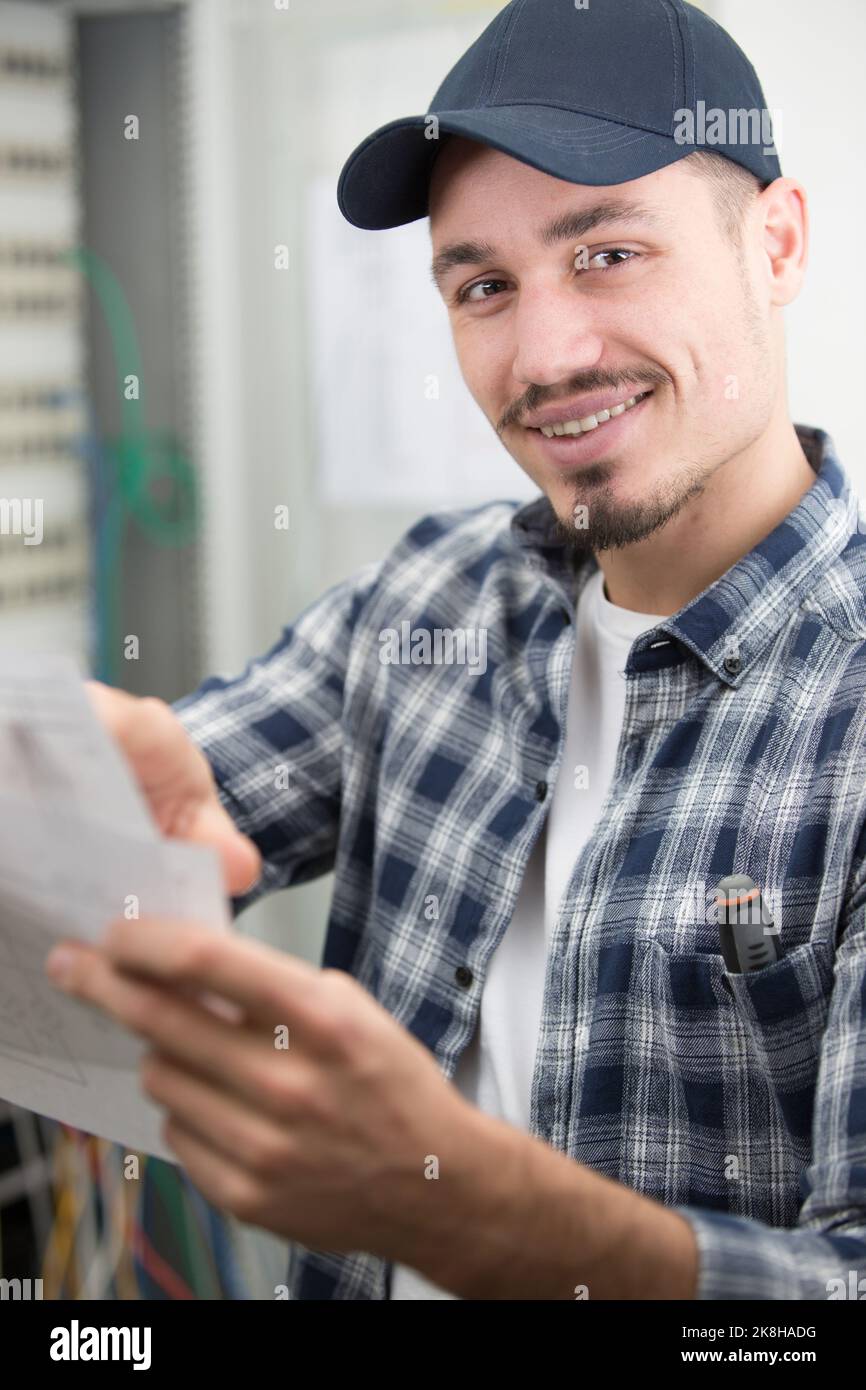 happy electronic engineer smiling at camera Stock Photo - Alamy