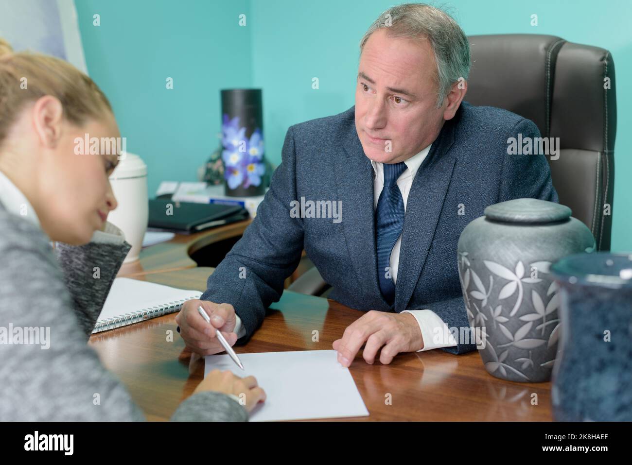 unhappy boss having a chat with his secretary Stock Photo - Alamy
