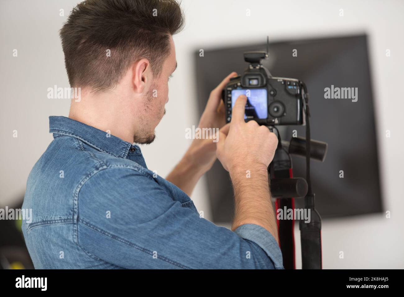 male photographer taking a photo Stock Photo - Alamy