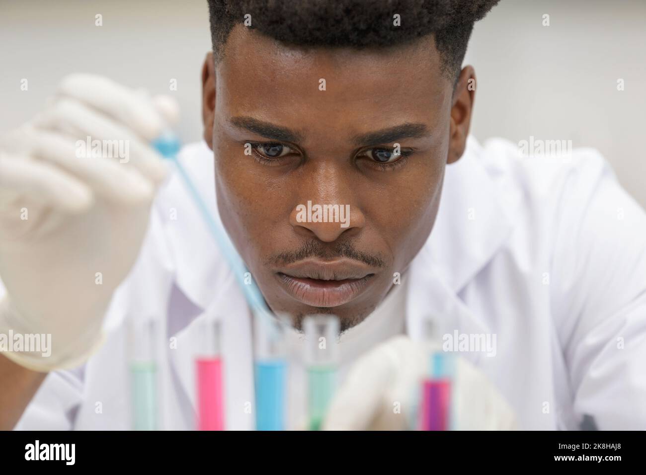 Man glasses pipette biochemistry hi-res stock photography and images ...
