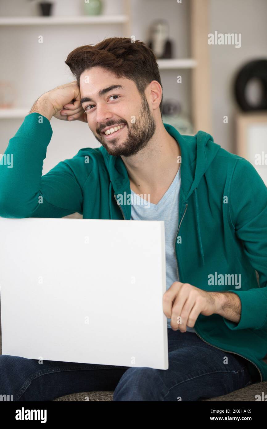 Man sat on sofa hi-res stock photography and images - Alamy