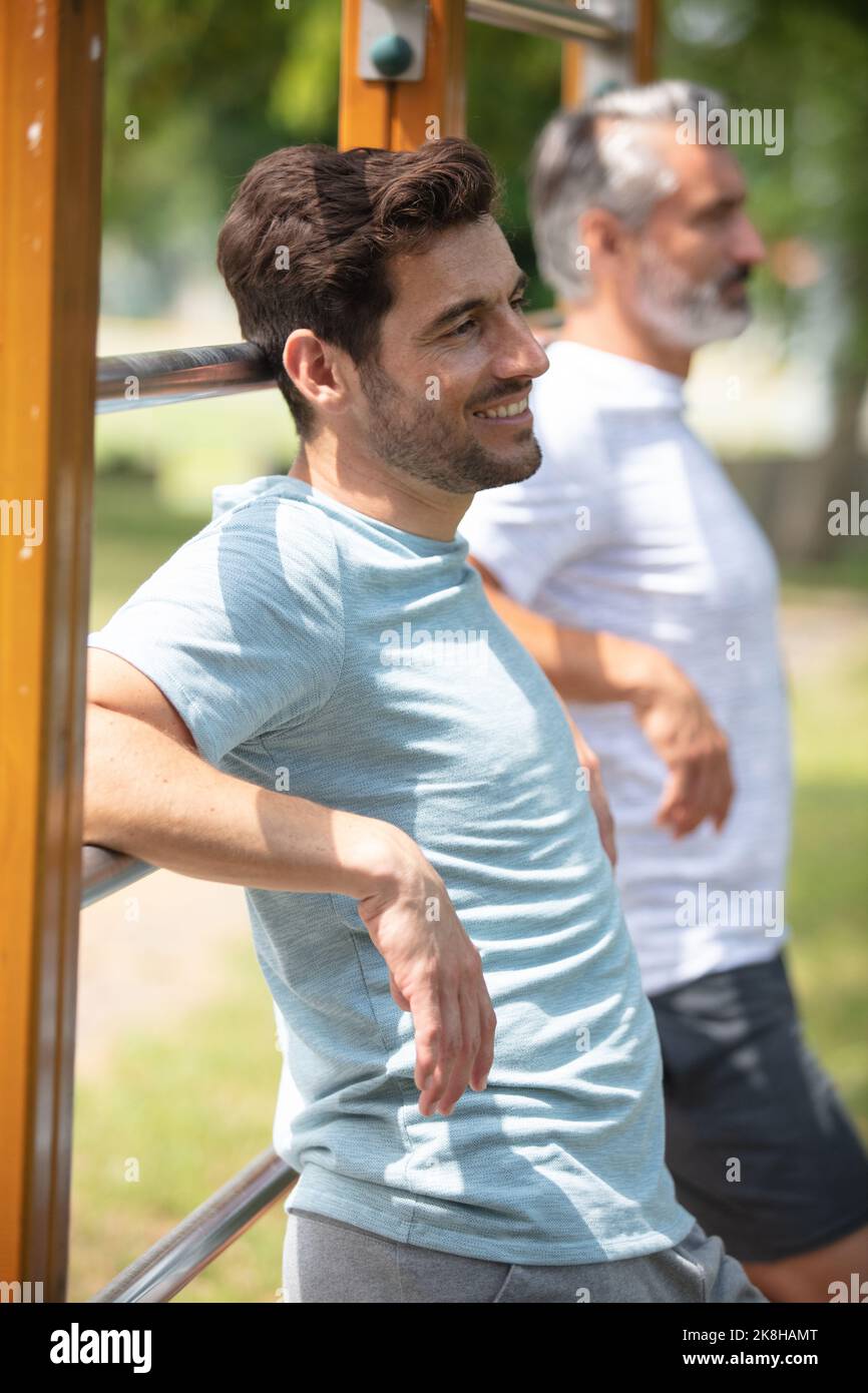 tired men breathing from heat exhaustion Stock Photo - Alamy