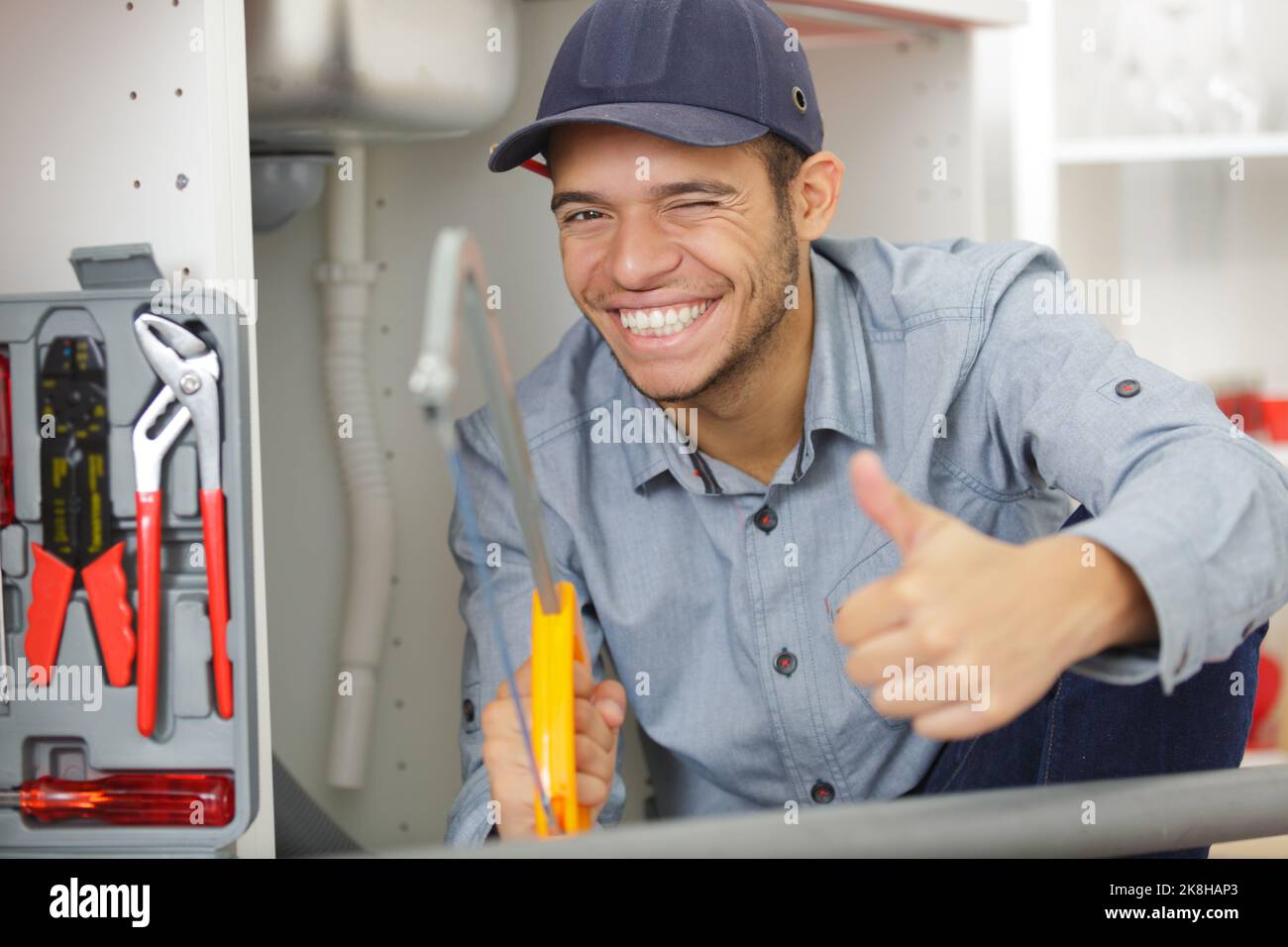 a happy technician giving thumb-up Stock Photo - Alamy
