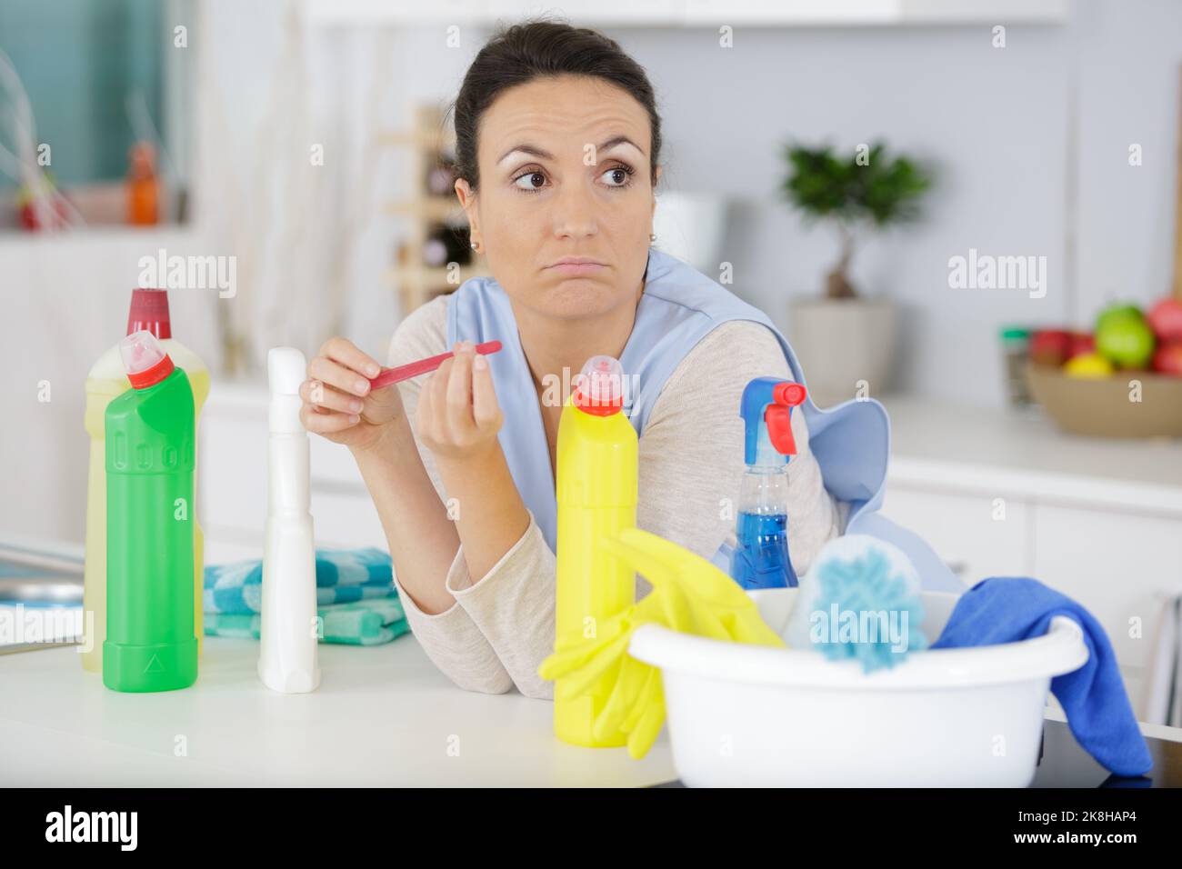 bored cleaner filing her nails Stock Photo - Alamy