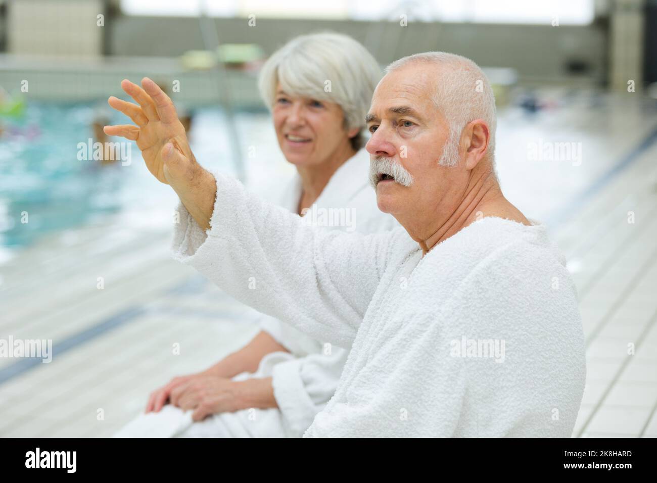 senior couple relaxing in swimming pool together Stock Photo - Alamy
