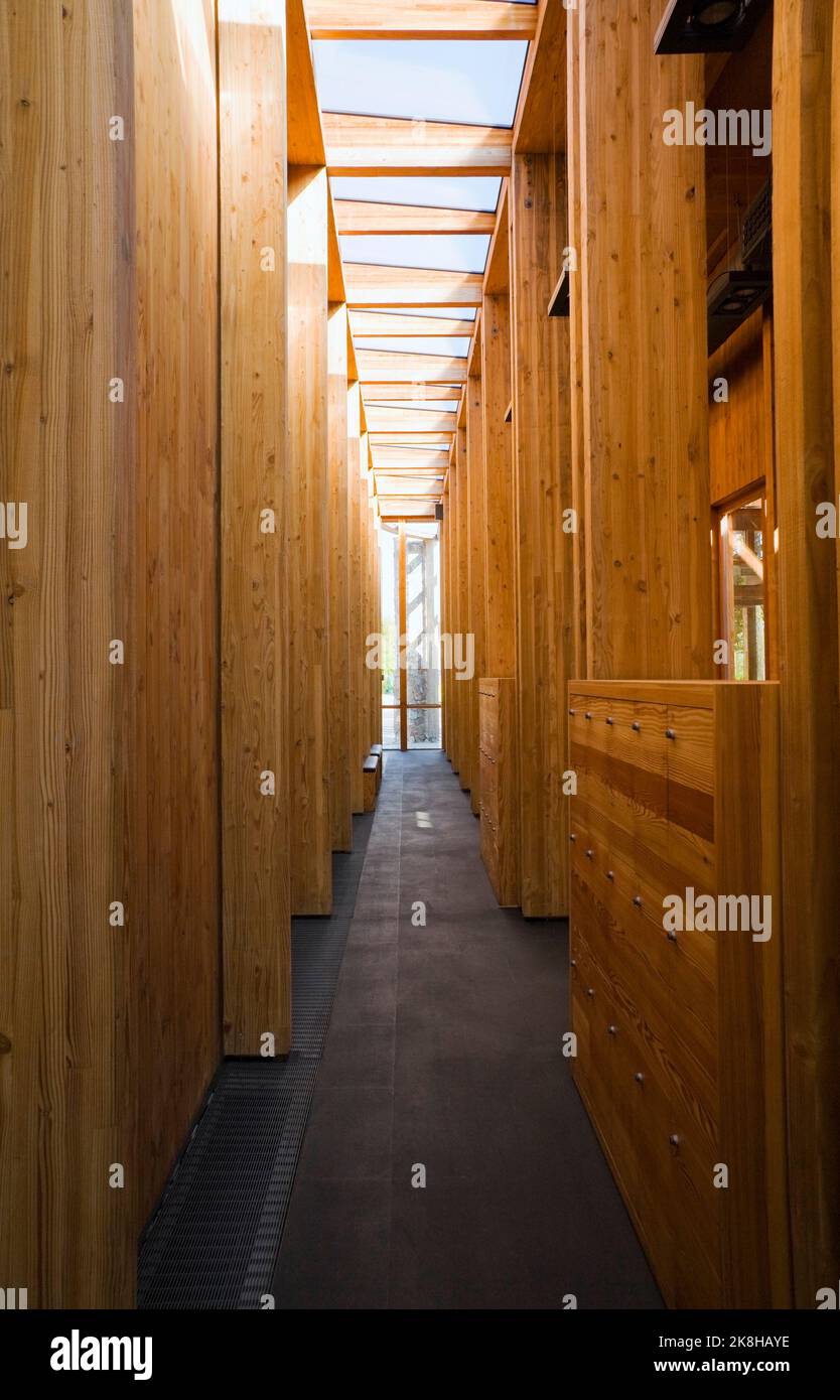 Interior of modern glass, wood and stone information center pavilion at ...