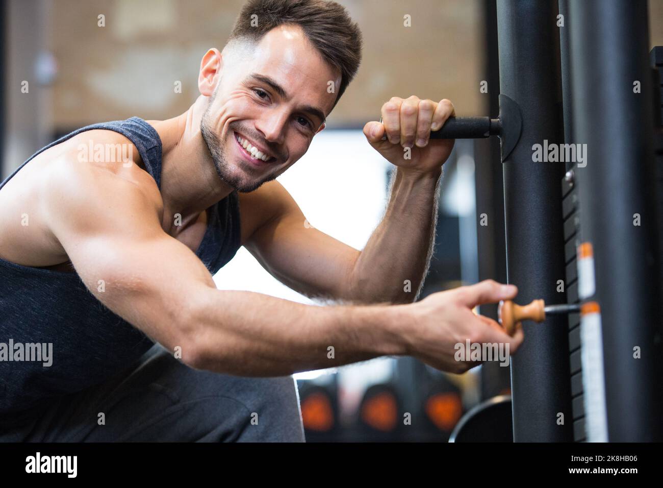 bodybuilder changing weights before start exercises Stock Photo - Alamy