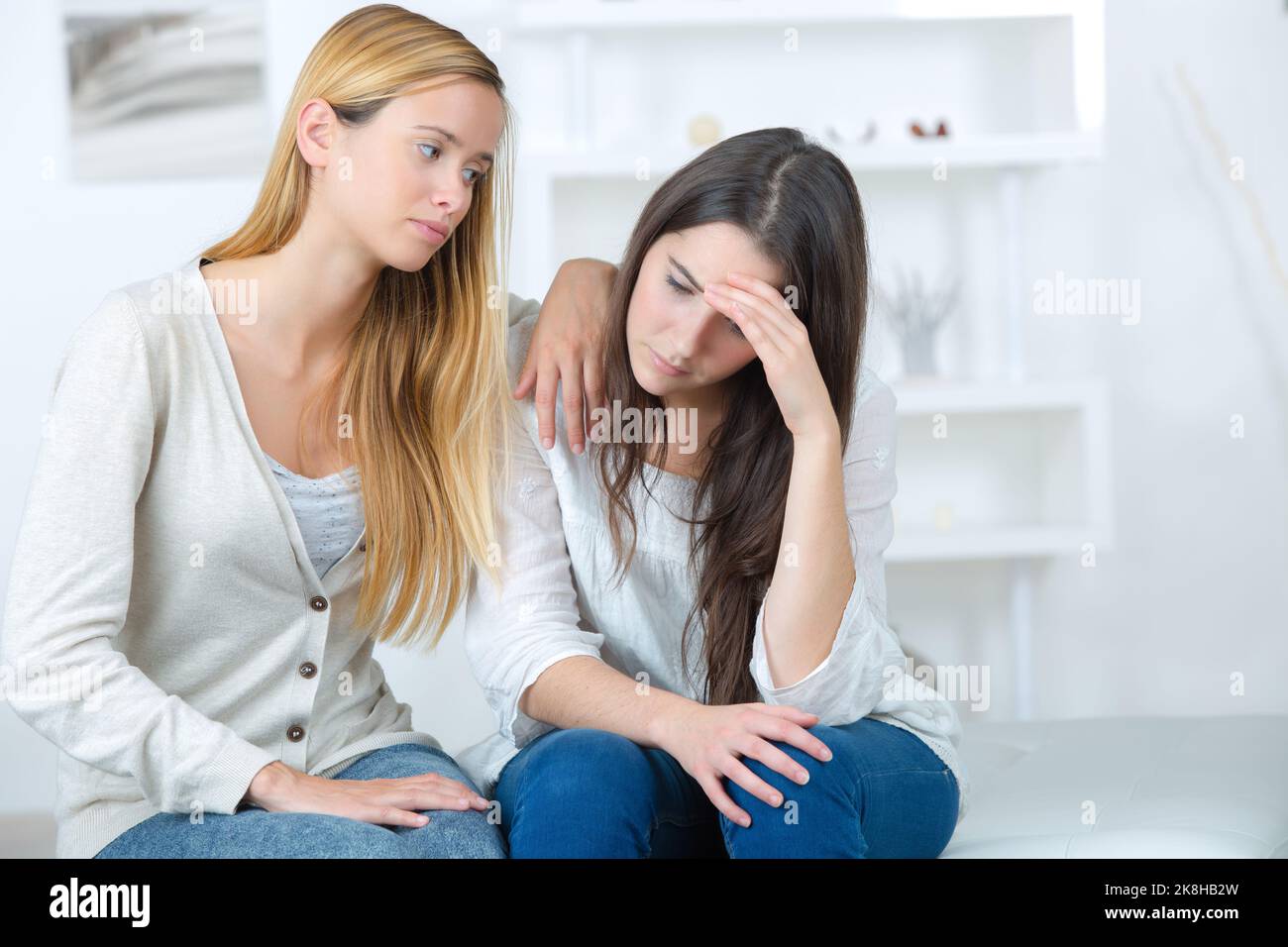 woman hugging her depressed friend at home Stock Photo - Alamy
