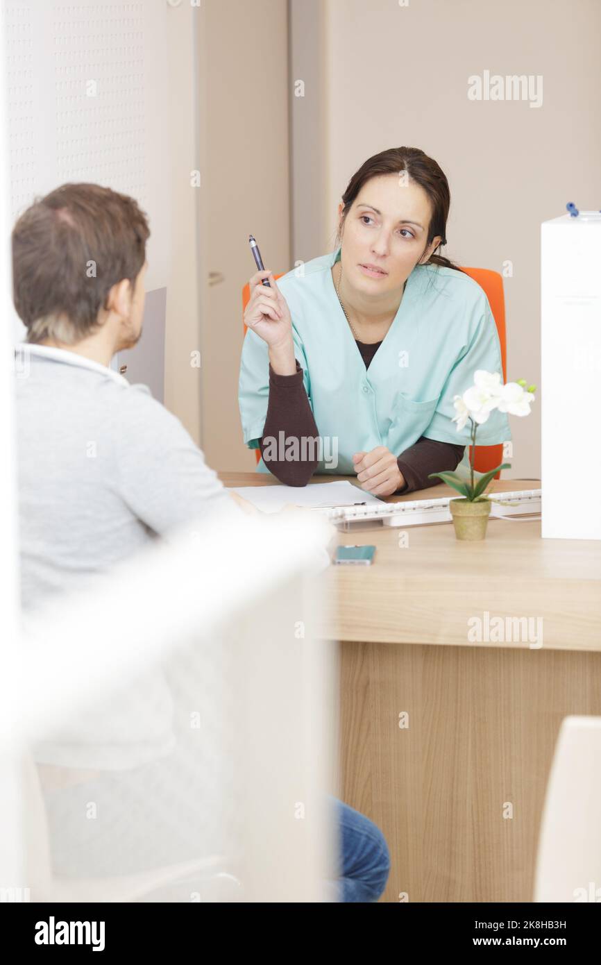 Woman reception male dentist hi-res stock photography and images - Alamy