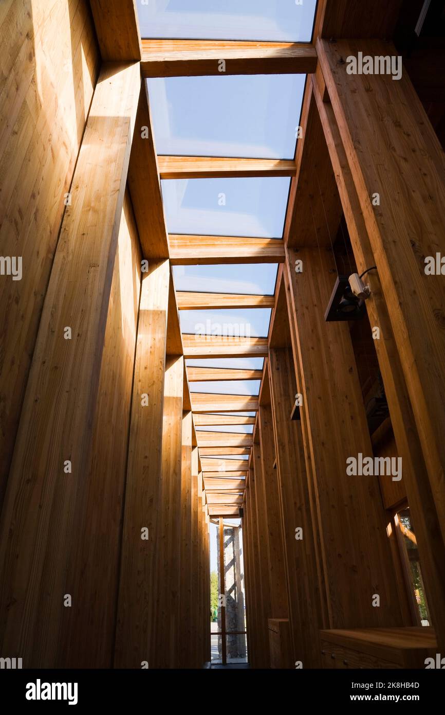 Interior of modern glass, wood and stone information center pavilion at ...