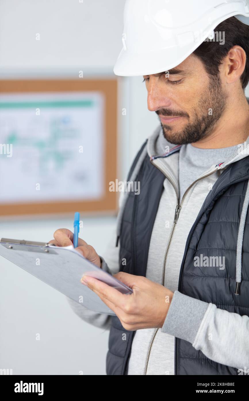 inspector is checking and inspecting the building Stock Photo - Alamy