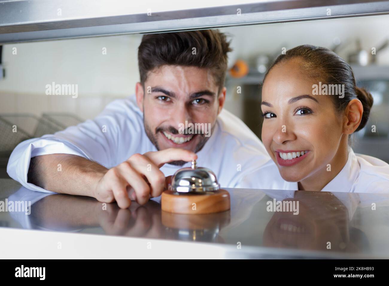 man and woman chefs in a kitchen Stock Photo - Alamy