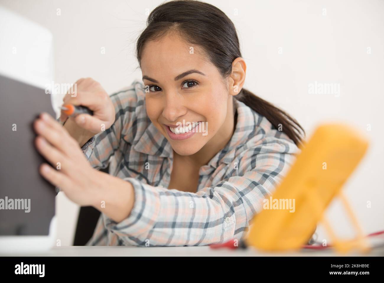 happy woman screwdriver Stock Photo - Alamy