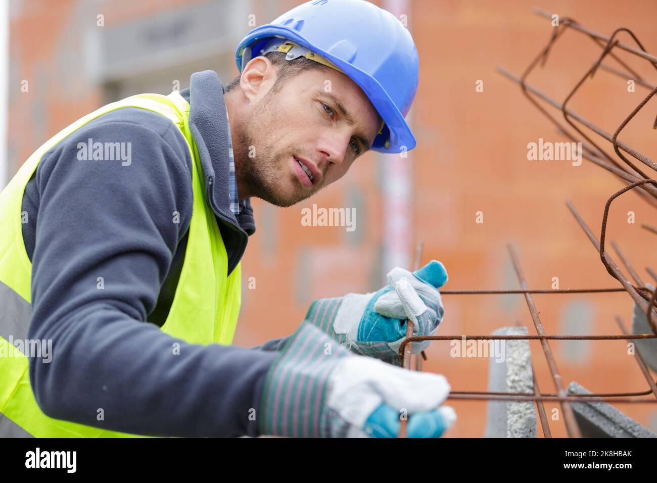worker fixing steel rebars on building site Stock Photo - Alamy