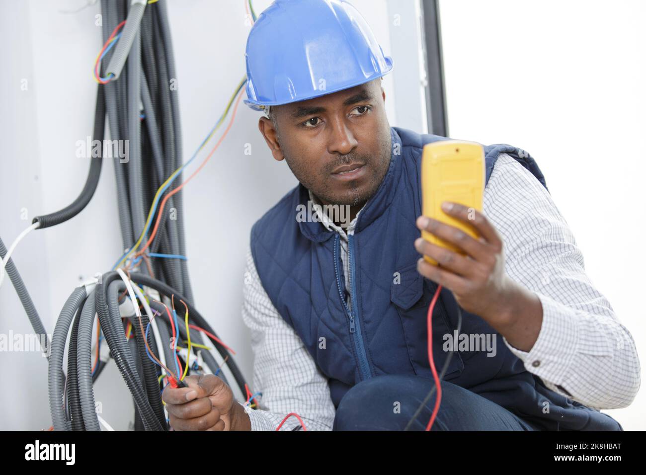 man holding a multimeter Stock Photo - Alamy