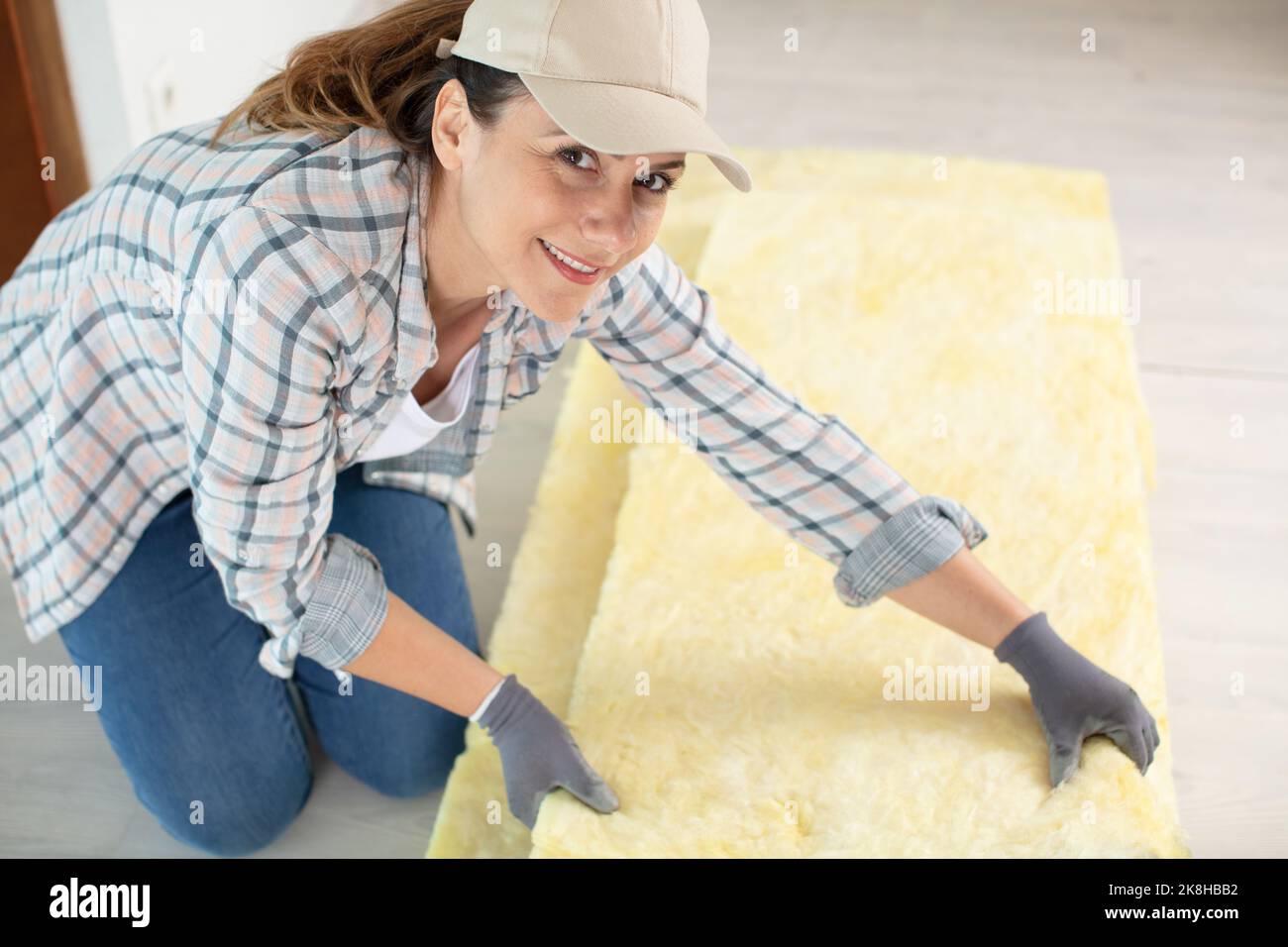 female worker installing insulant at workplace Stock Photo - Alamy