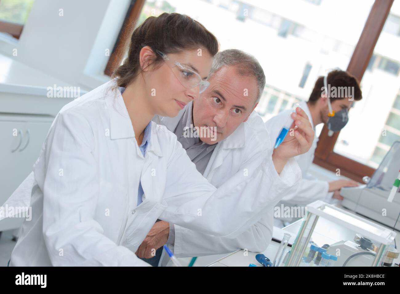 teenage students caring out experiments in chemistry class Stock Photo - Alamy