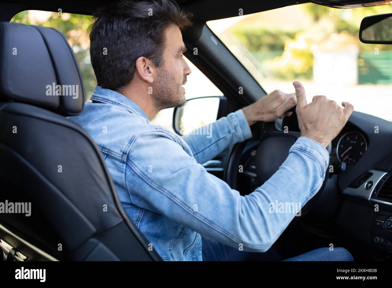 Man in suit driving hi-res stock photography and images - Alamy