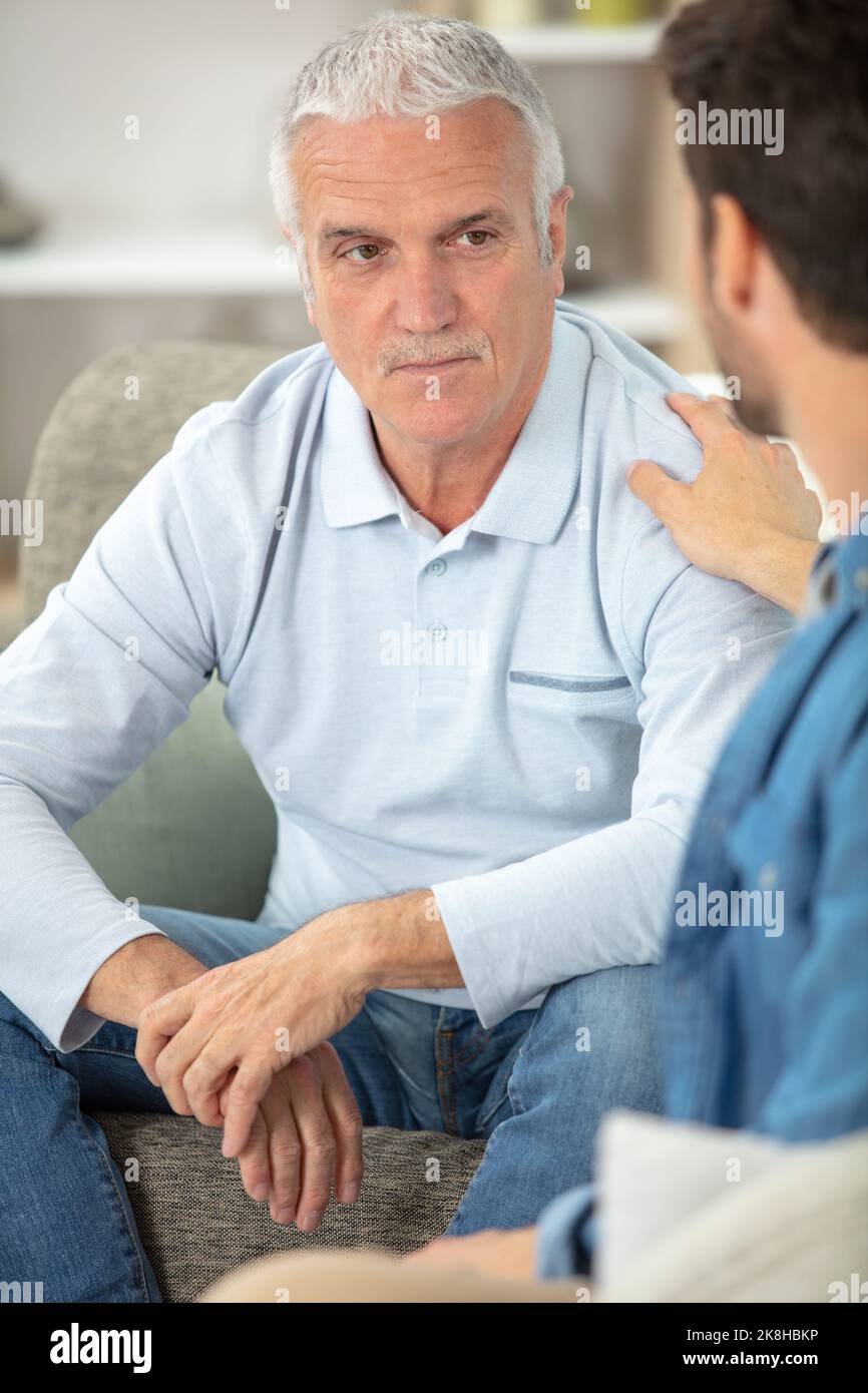 happy old father and son at home Stock Photo - Alamy