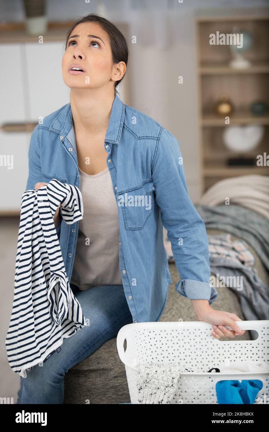 Laundry angry woman clothes hi-res stock photography and images - Alamy