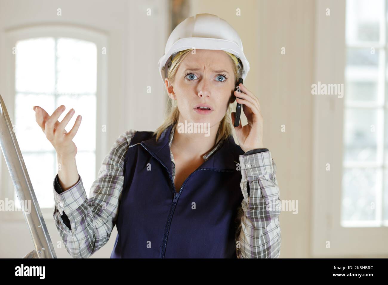 an angry business woman architect on the phone Stock Photo - Alamy